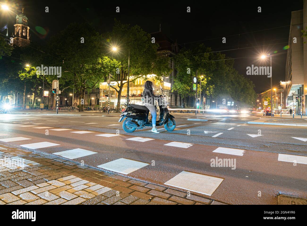 Rotterdam Netherlands - August 23 2017; Young woman on motor-scooter ...