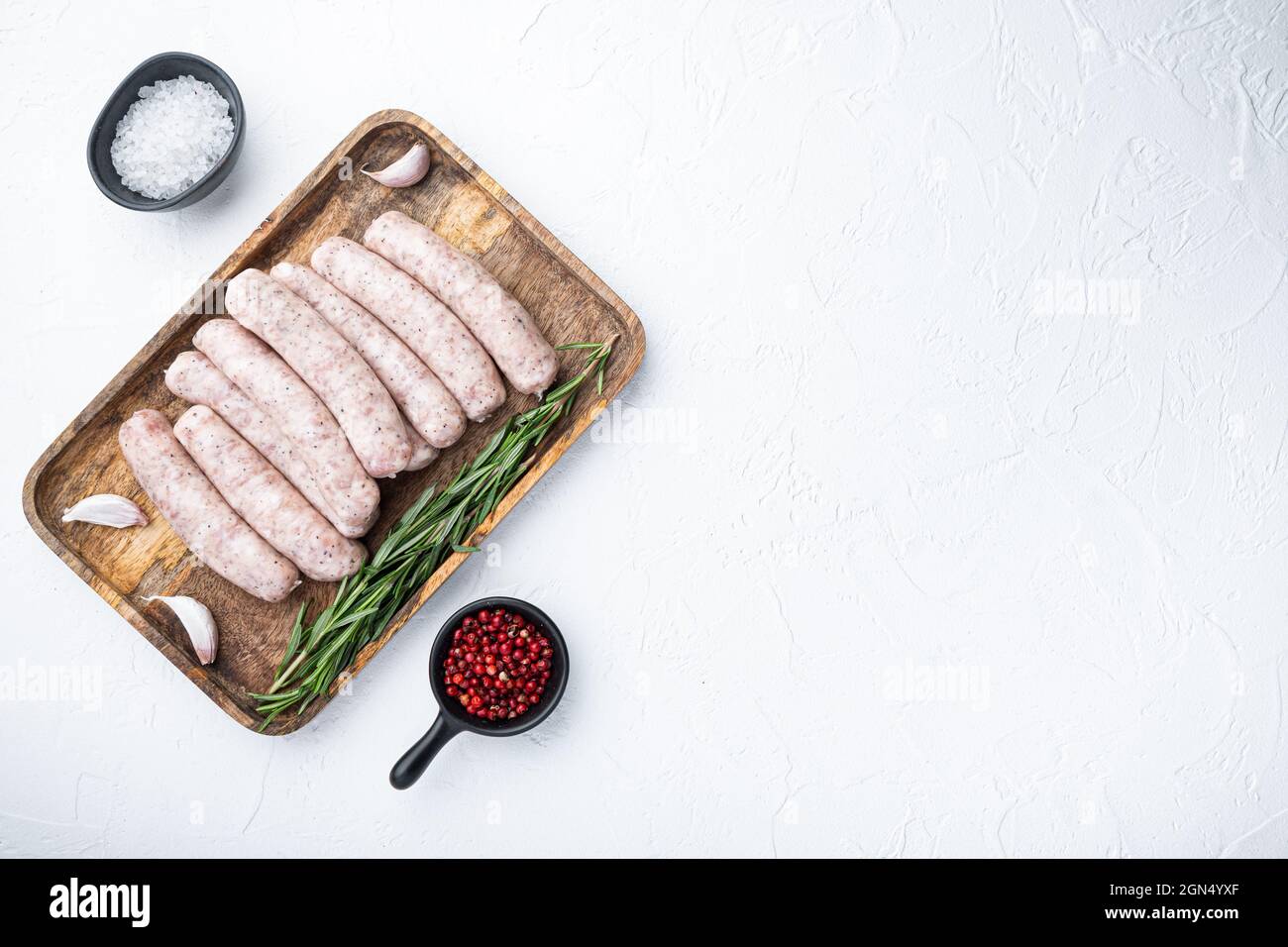 Chicken sausages, flat lay with space for text, on white background ...