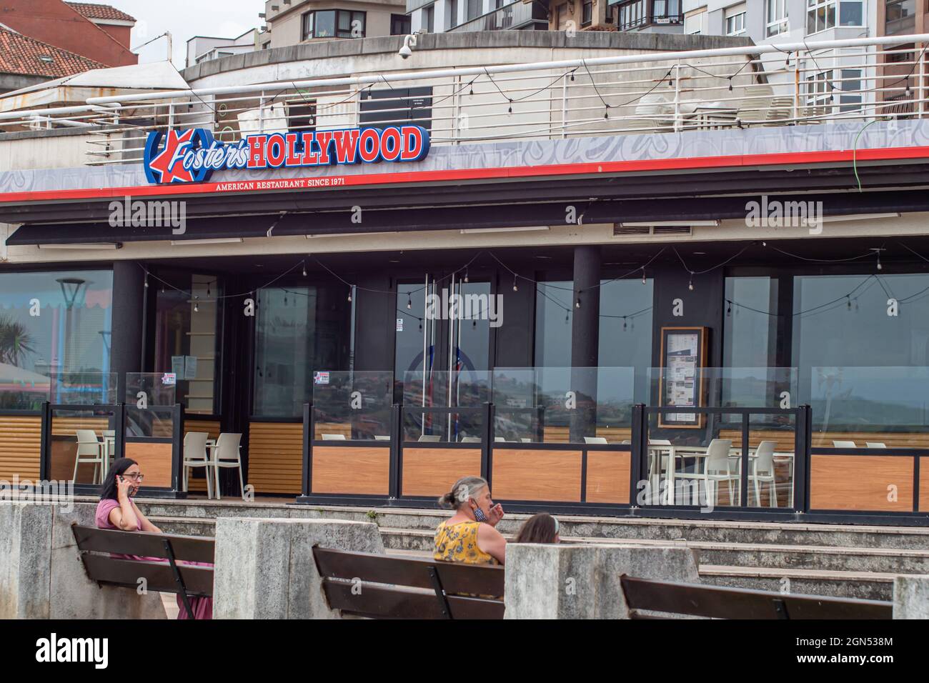 View of a cafe near the port with glass doors with wooden parts on a ...