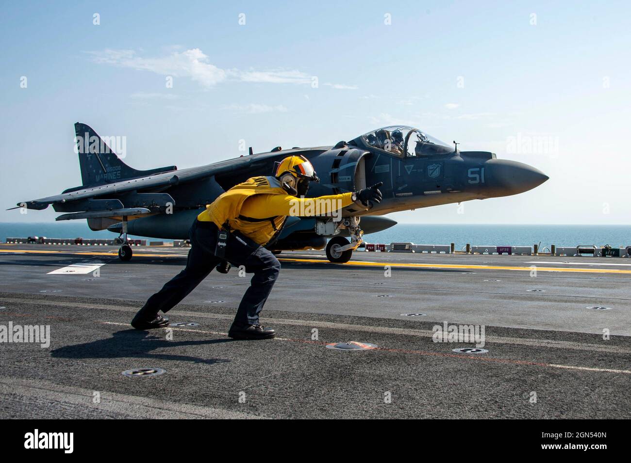 Arabian Sea, At Sea. 19 September, 2021. A U.S. Navy sailor signals a ...