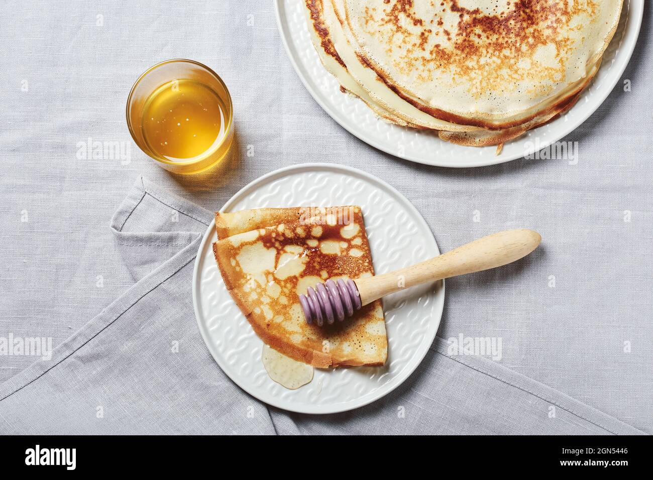 Homemade French crepes with honey, top view Stock Photo - Alamy