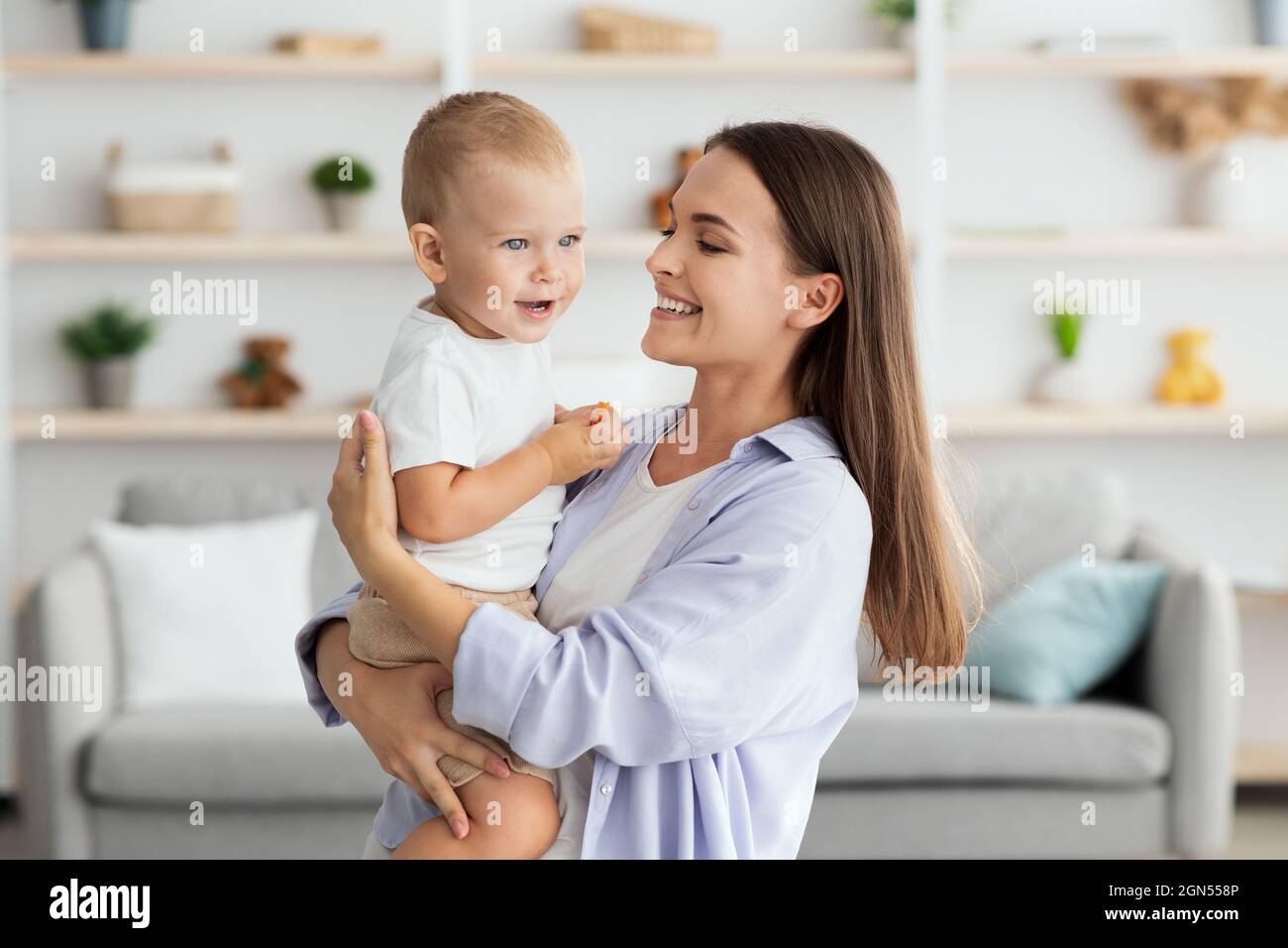 Motherhood Concept. Portrait Of Young Beautiful Mother Holding Adorable ...