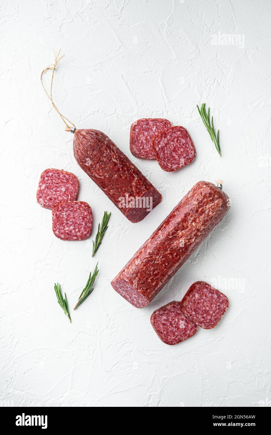 Salami with ingredients set, on white stone table background, top view ...