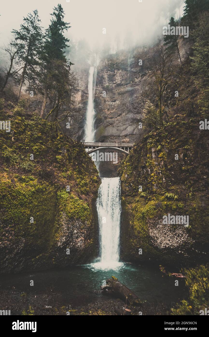 Vertical shot of the Multnomah Falls. Beautiful waterfall with a bridge ...