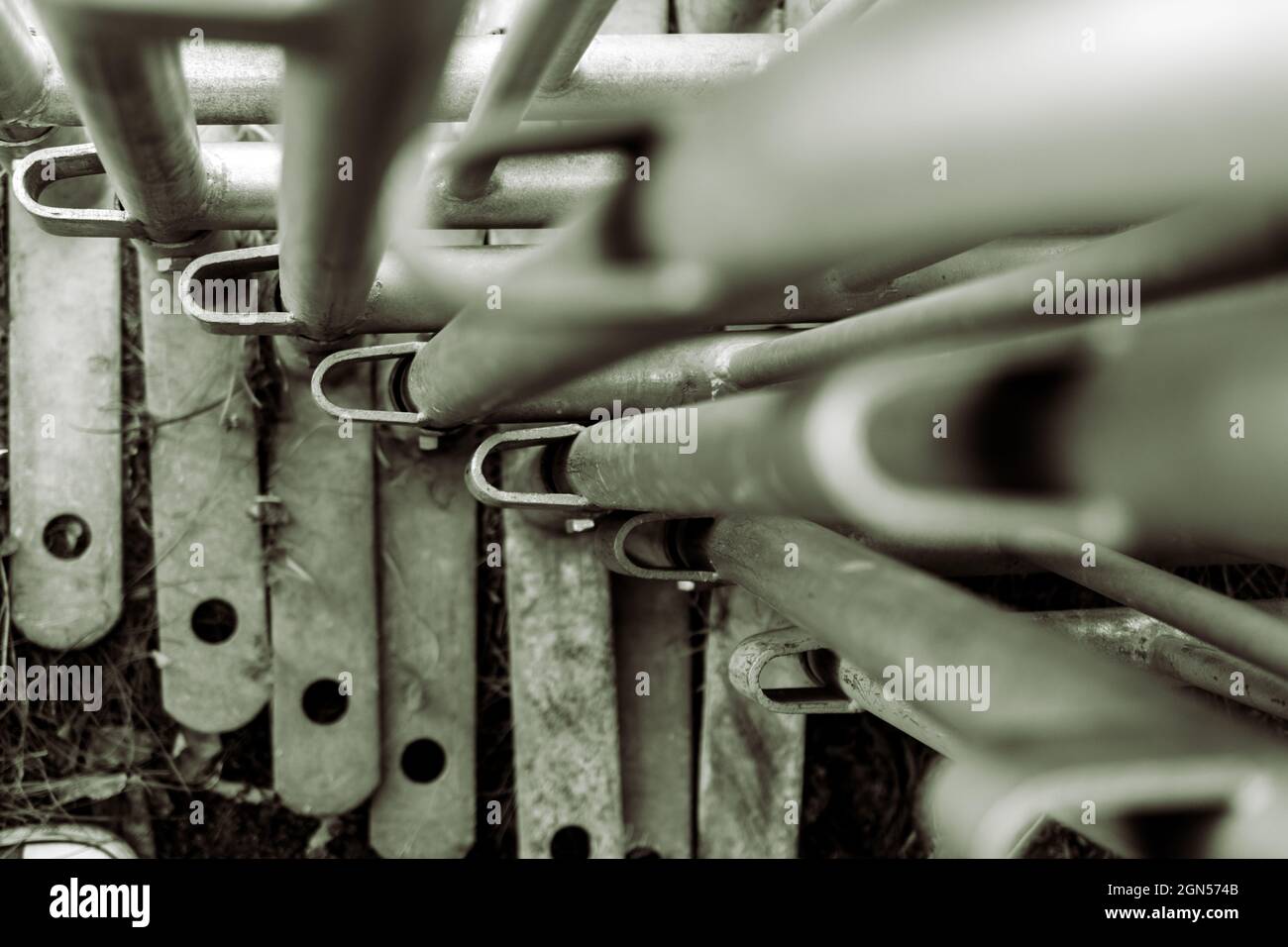 Overhead view of the stack of metal silver riot fences on the ground ...