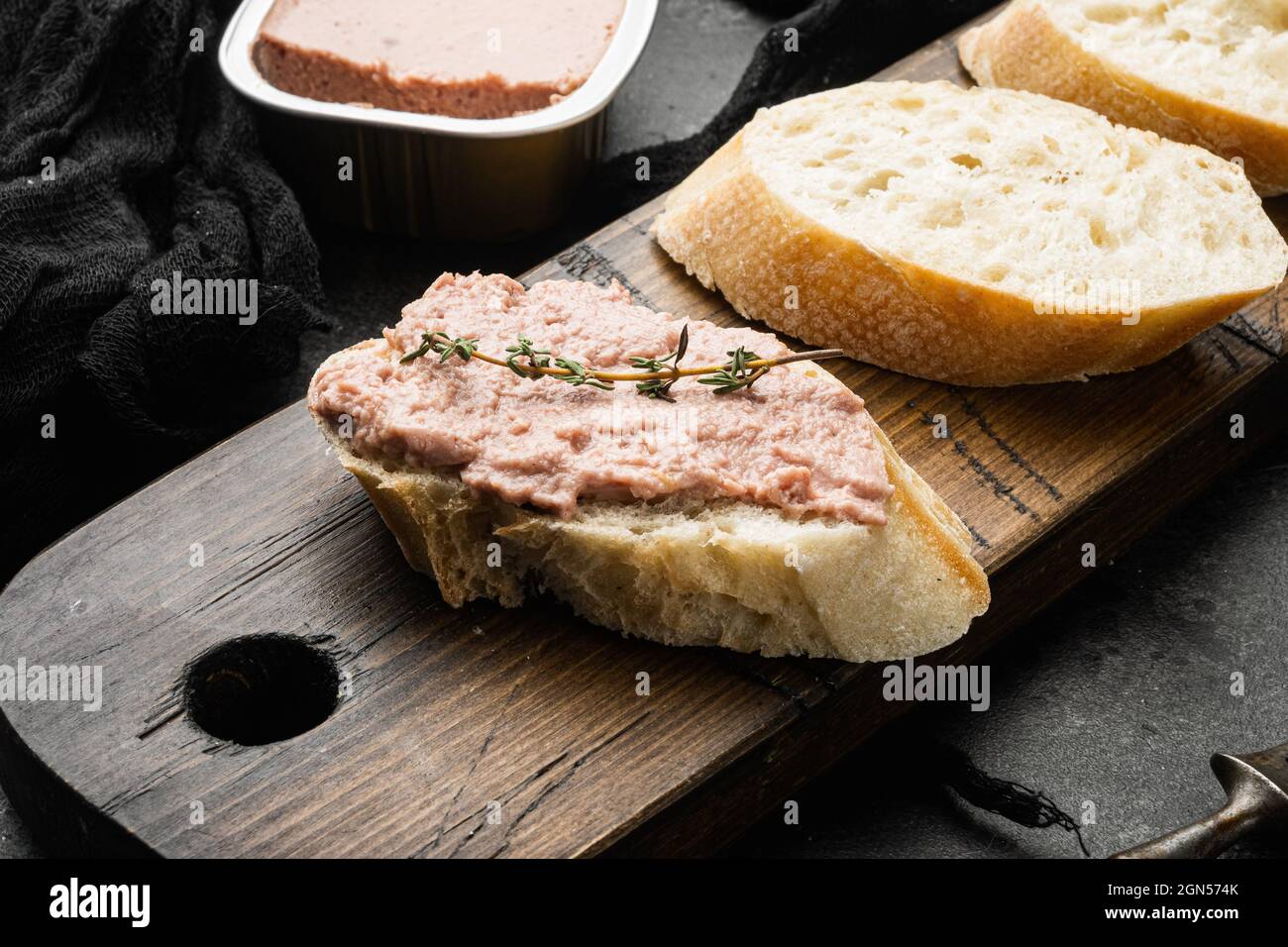 Liver pate on toast set, on black dark stone table background Stock ...