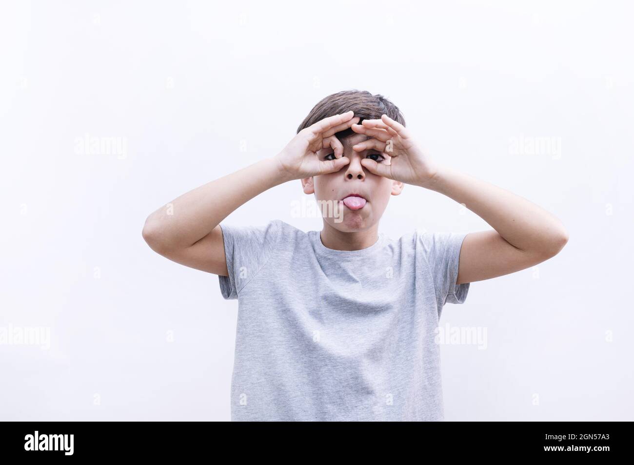Closeup shot of a Caucasian boy showing a fun expression Stock Photo ...