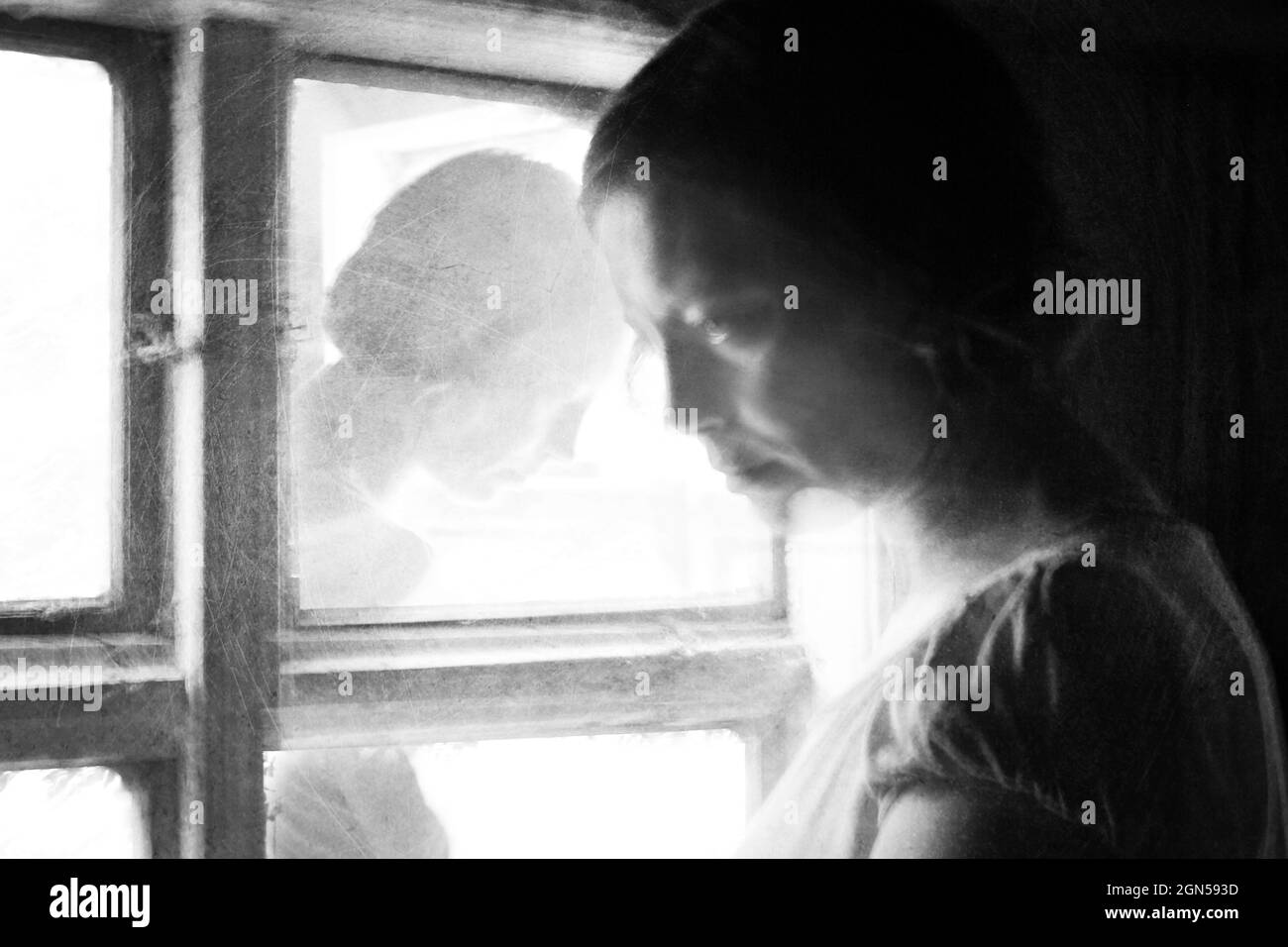 Surreal portrait. Woman looking through the old window. Portrait of a ...