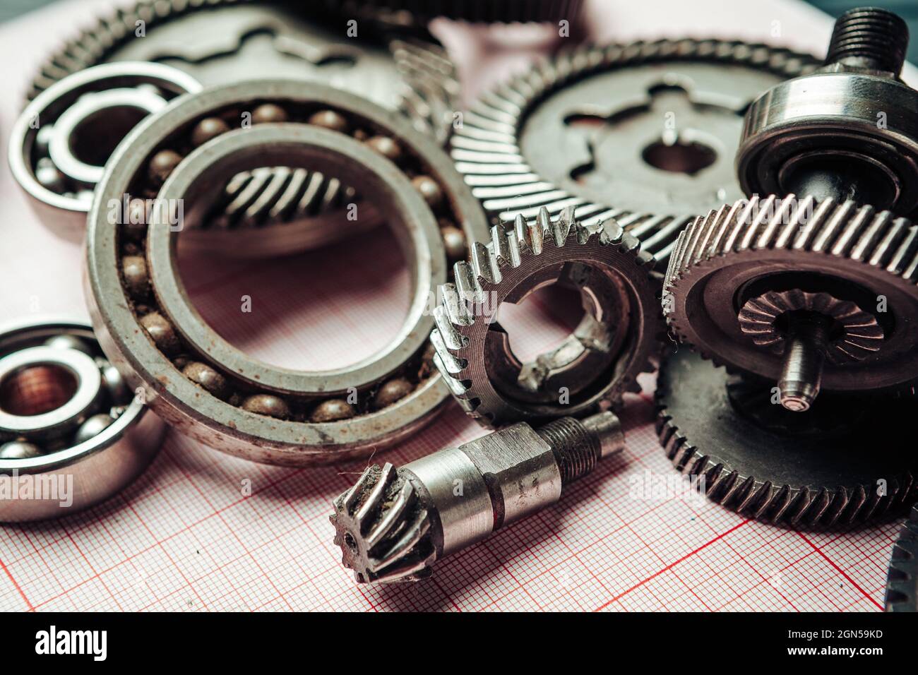 Car parts on graph paper close up. Engineering concept Stock Photo - Alamy