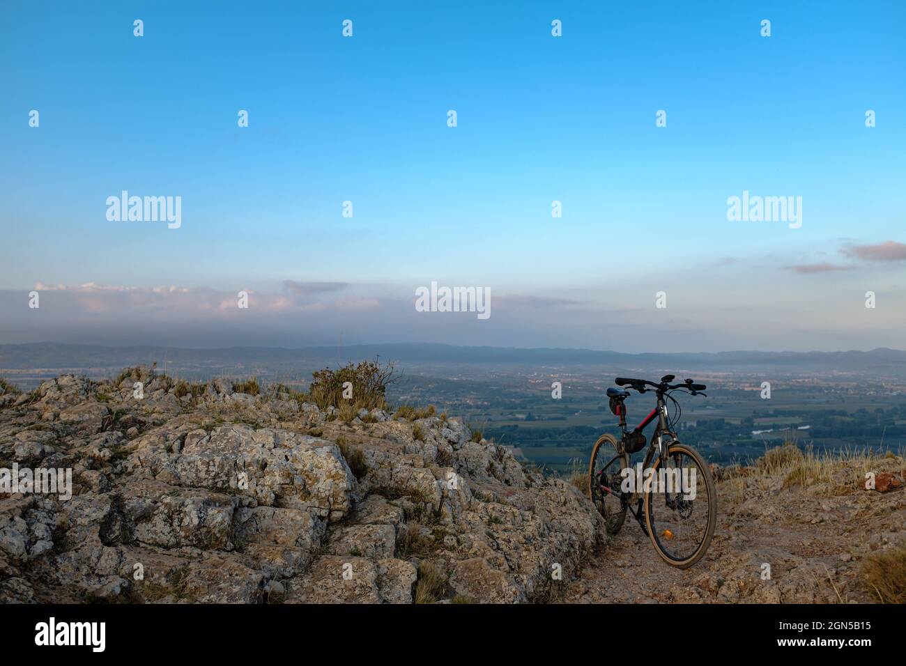 Mountain bicycle on top of a rock mountain peak scenic landscape view ...