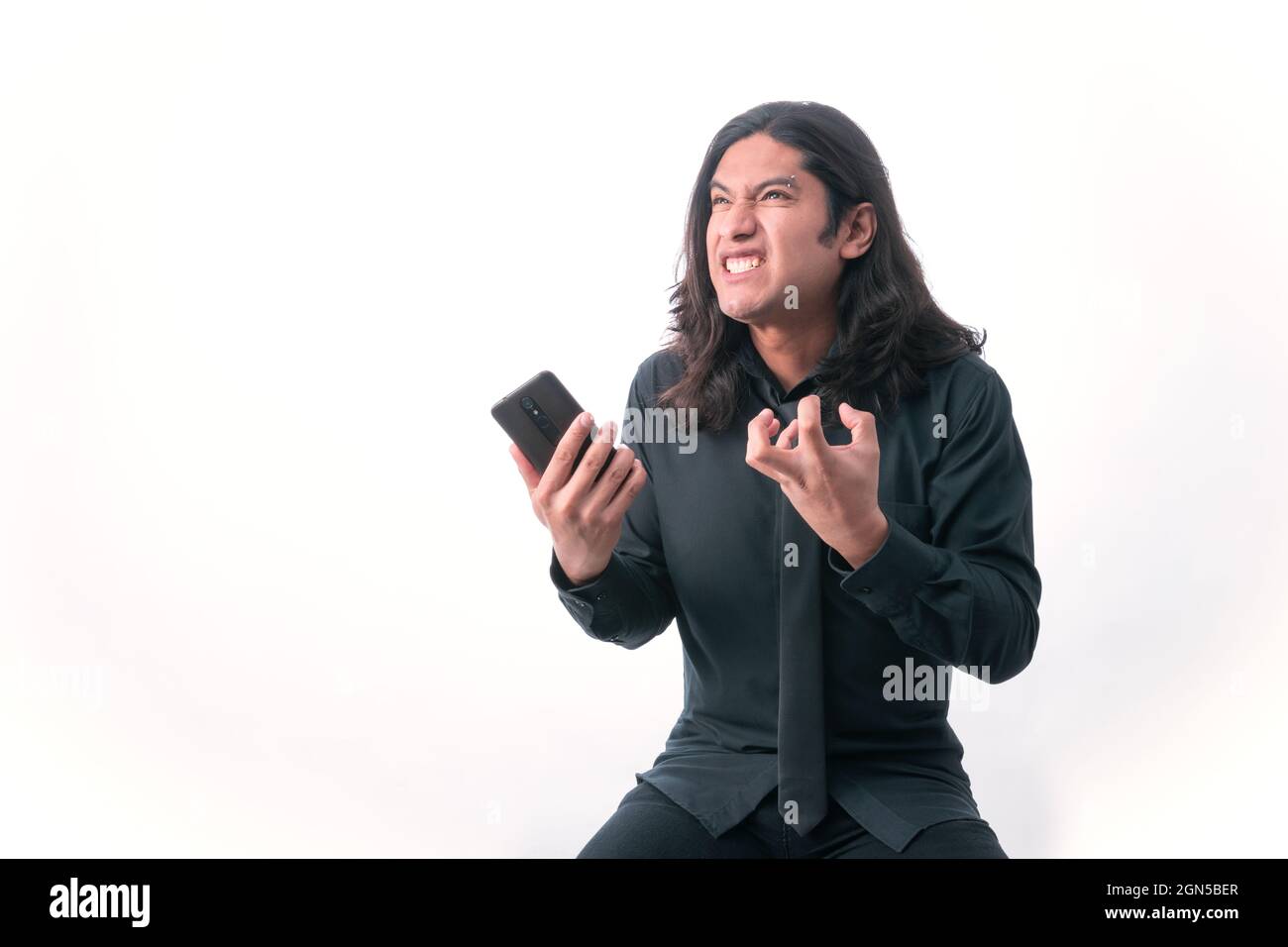 Person with white background. He looks up and is very angry about ...