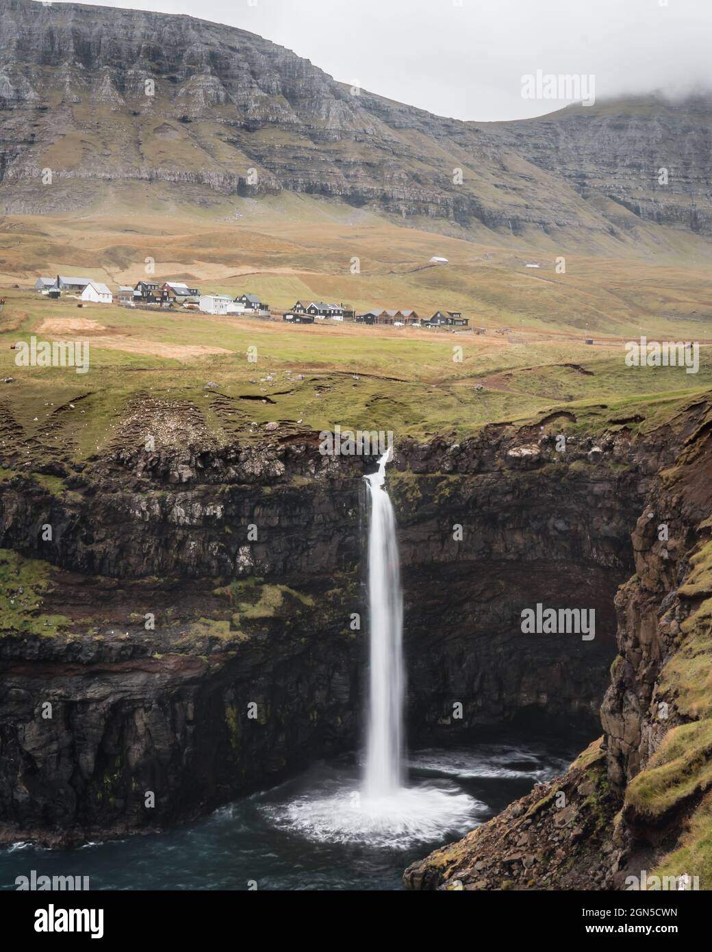 Mulafossur Waterfall with the village Gasadalur on Faroe Islands ...