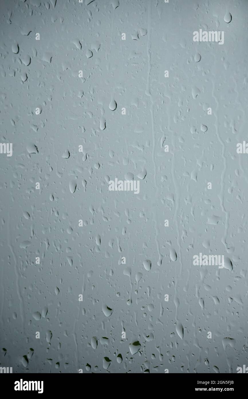 Vertical shot of raindrops on a window - perfect for wallpaper Stock ...