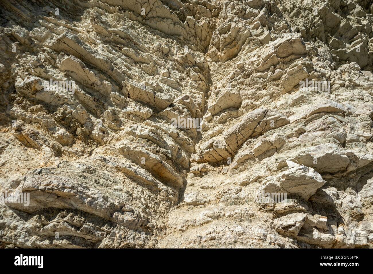 White layered rocks texture, geology close-up, cliff on coast of ...