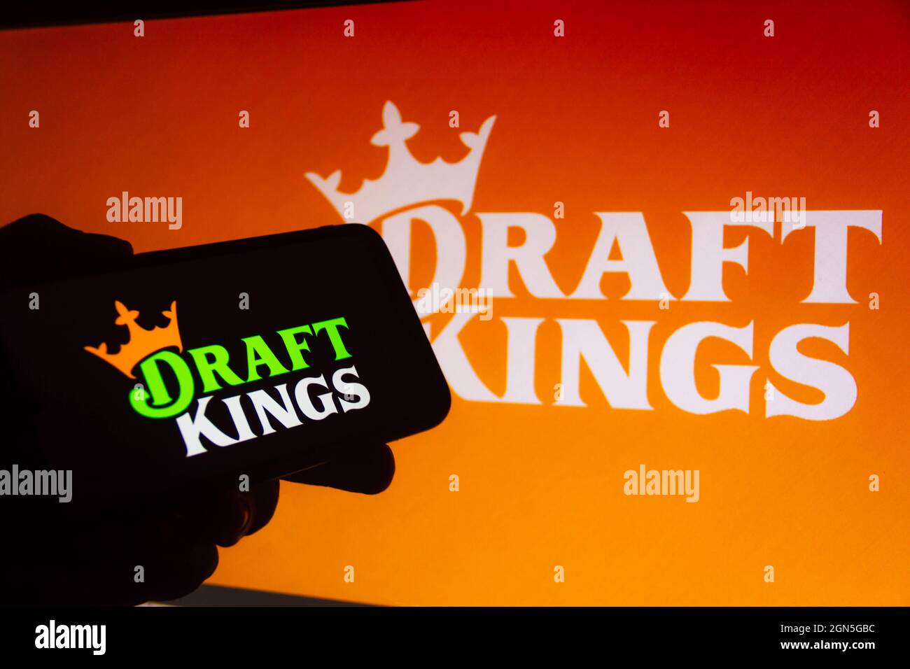 In this photo illustration the DraftKings logo seen displayed on a ...