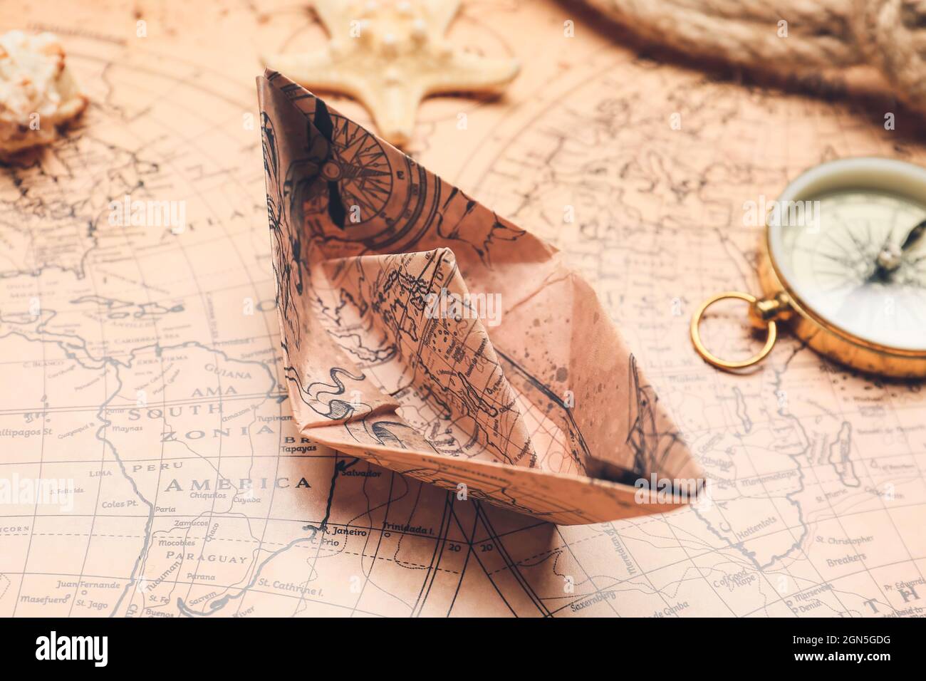 Paper boat on vintage world map Stock Photo - Alamy