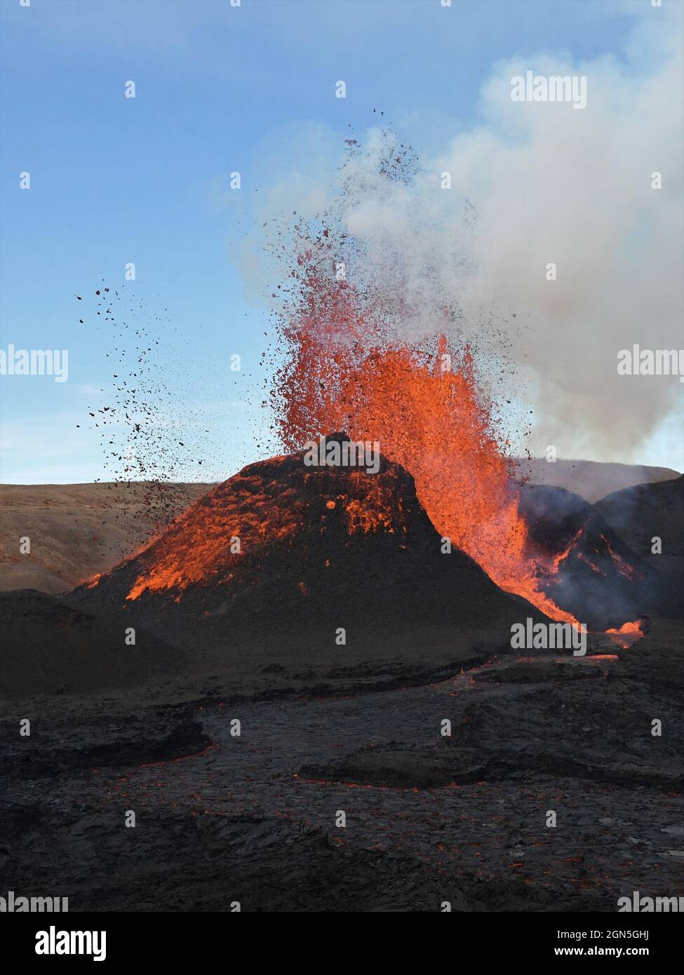 Volcanic vent at Fagradalsfjall, Iceland, erupting orange and red lava ...