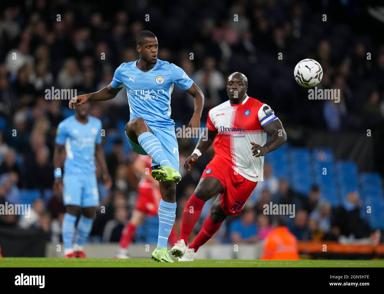 Manchester, UK. 21st Sep, 2021. Luke Mbete of Man City and Adebayo ...