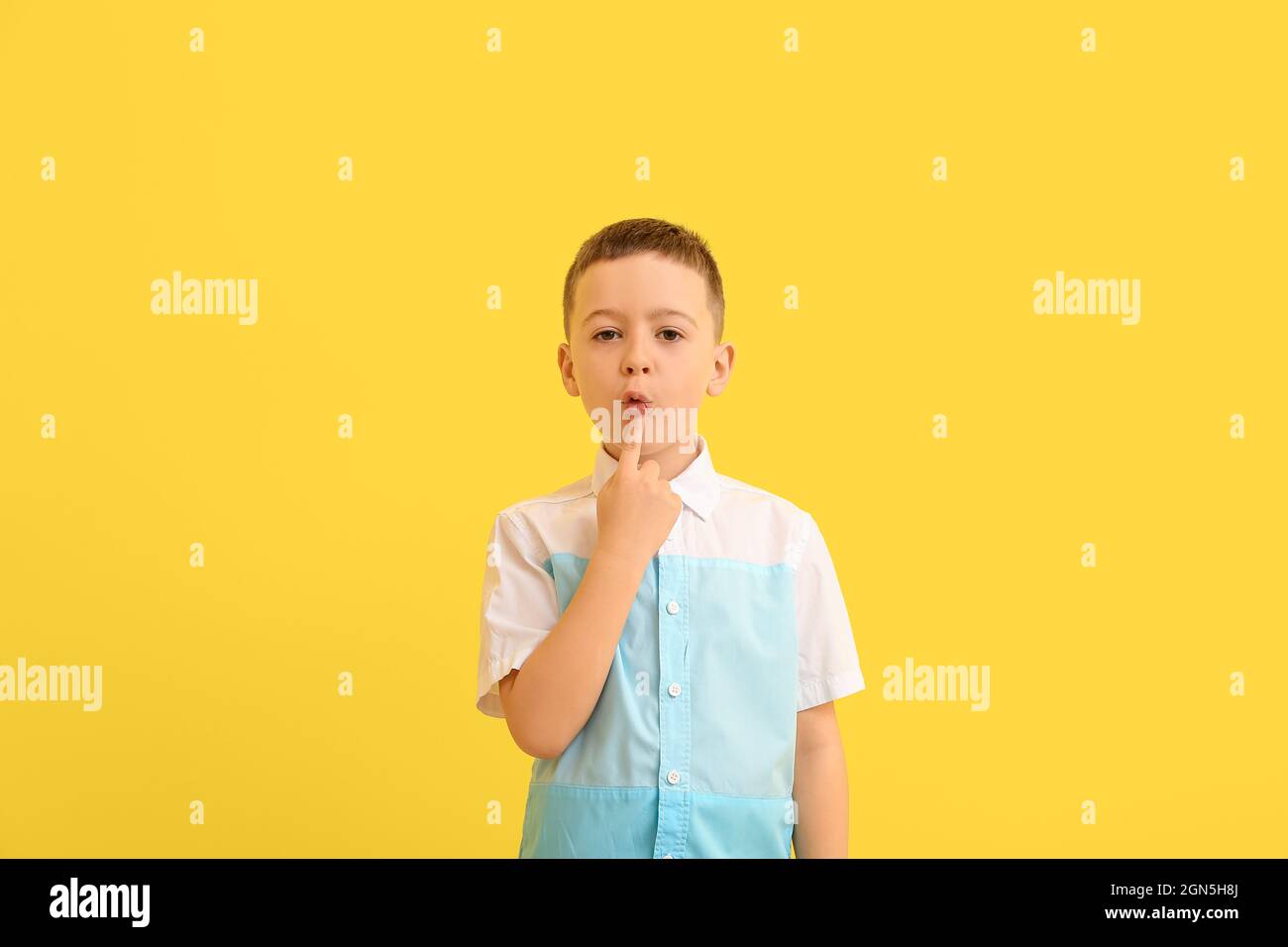 Little boy training pronounce letters on color background Stock Photo ...