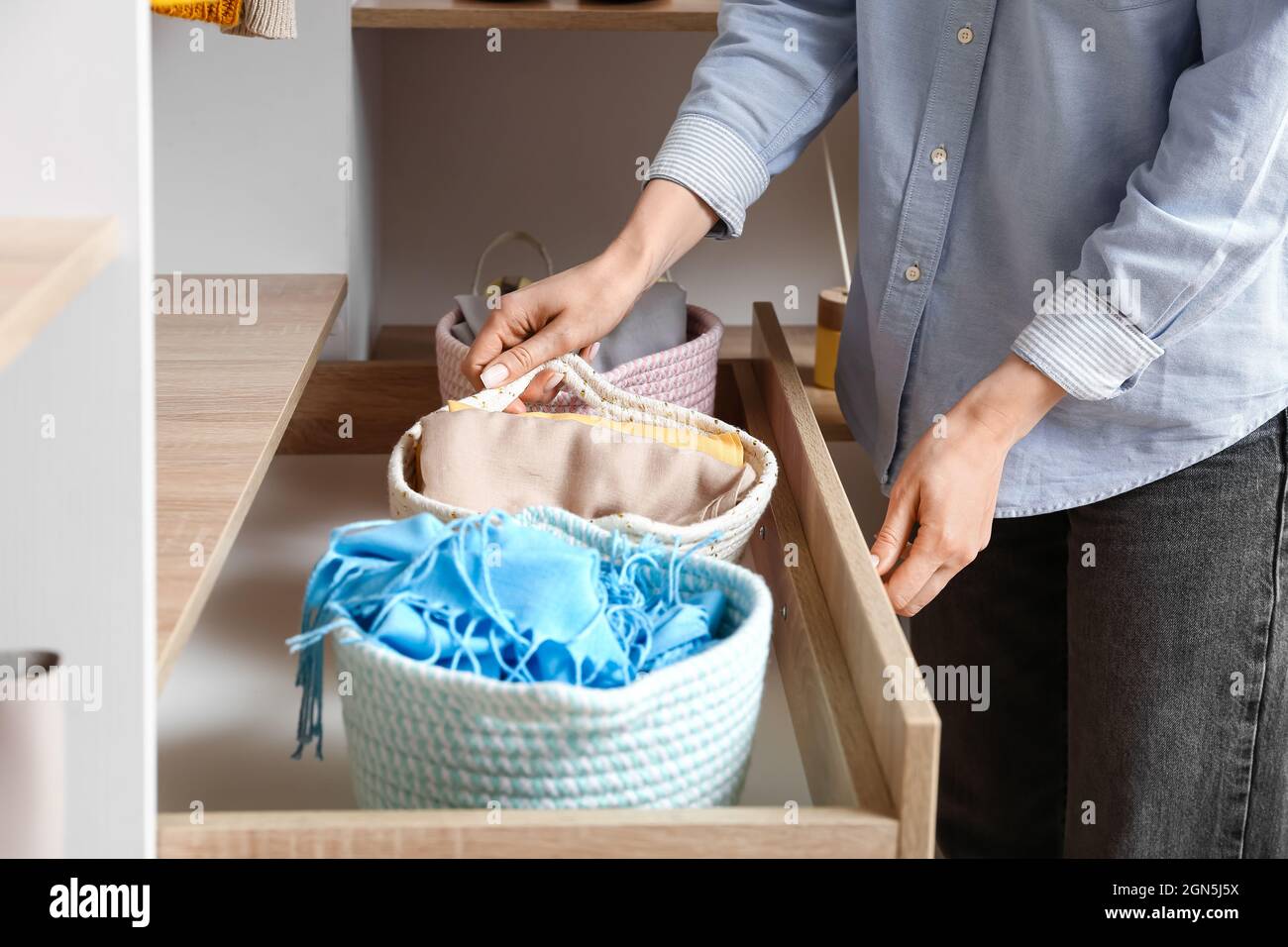 Woman with wardrobe organizer in dressing room, closeup Stock Photo - Alamy