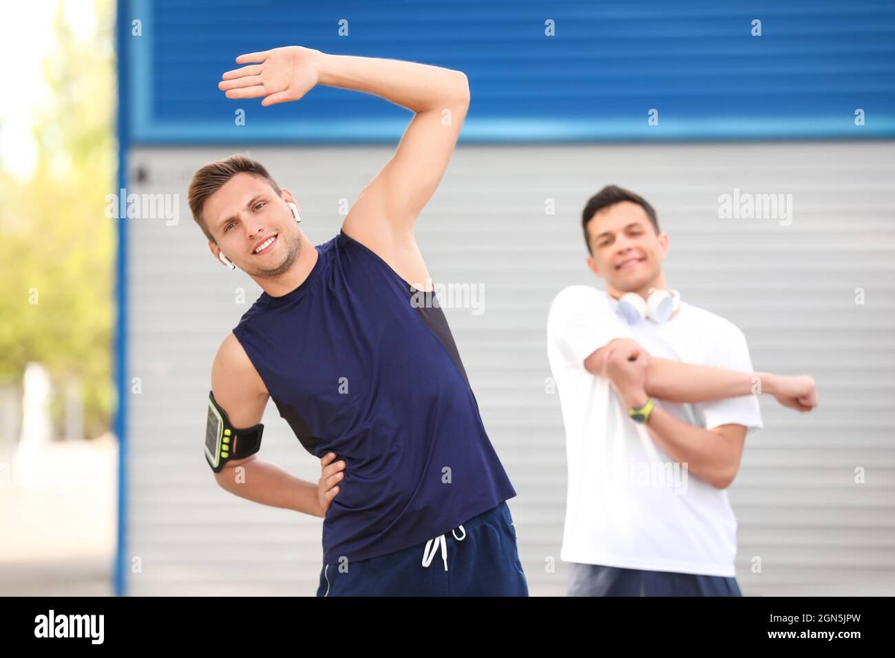 Sporty young man exercising hi-res stock photography and images - Alamy
