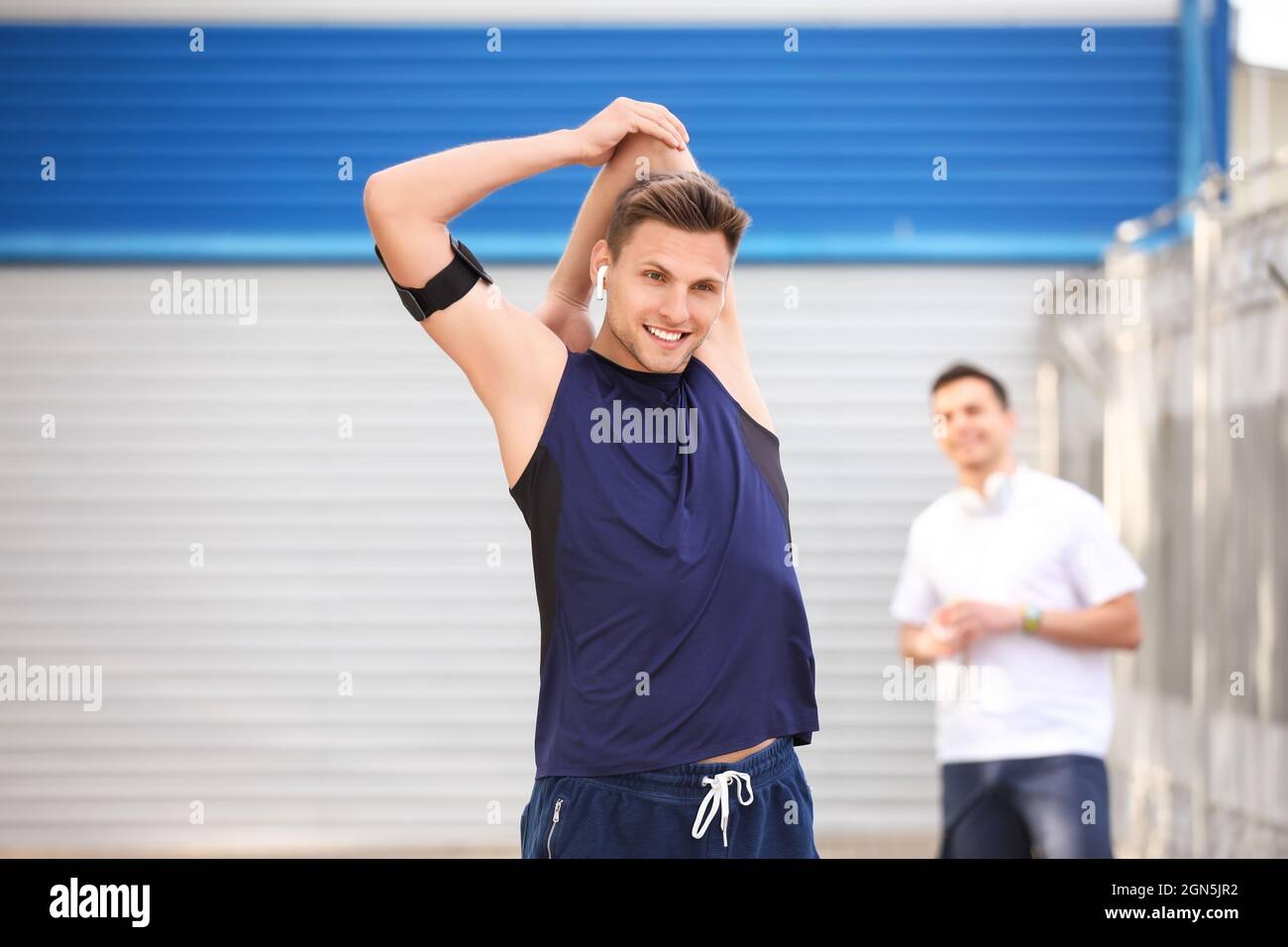 Sporty young man exercising hi-res stock photography and images - Alamy