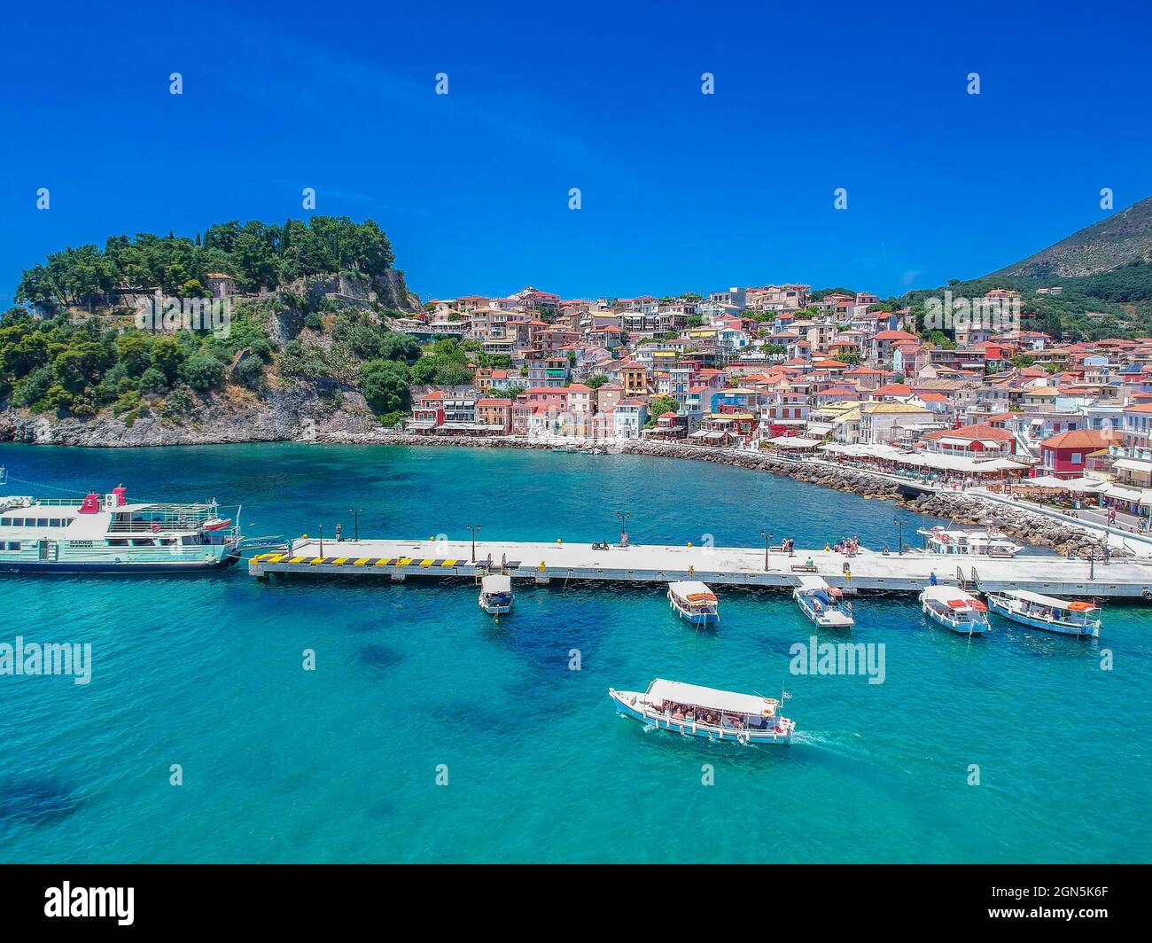 Aerial panoramic cityscape view over Parga coastal city, Epirus, Greece ...