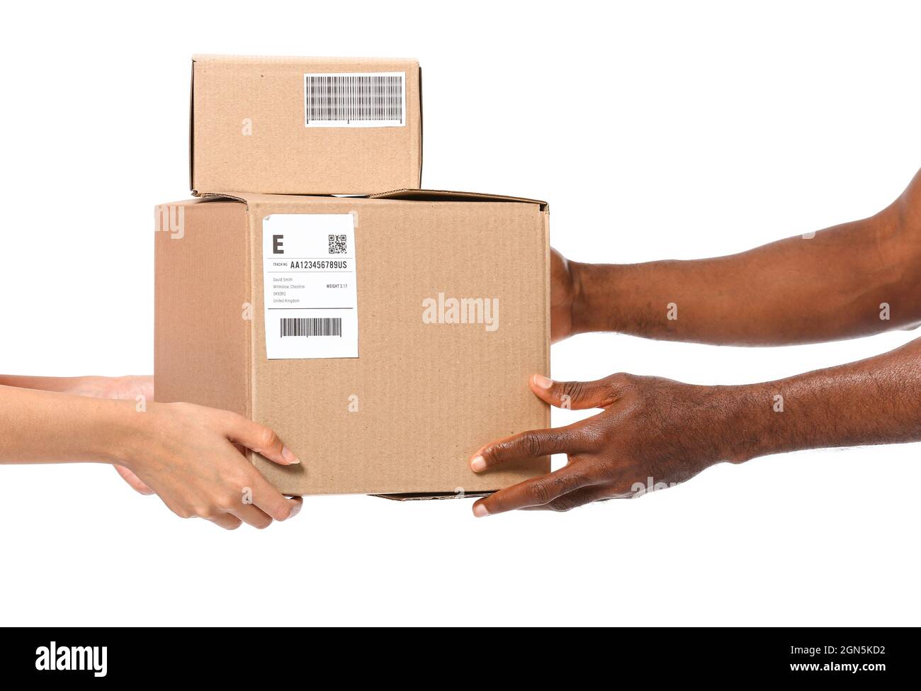 Customer receiving parcel from courier on white background Stock Photo ...