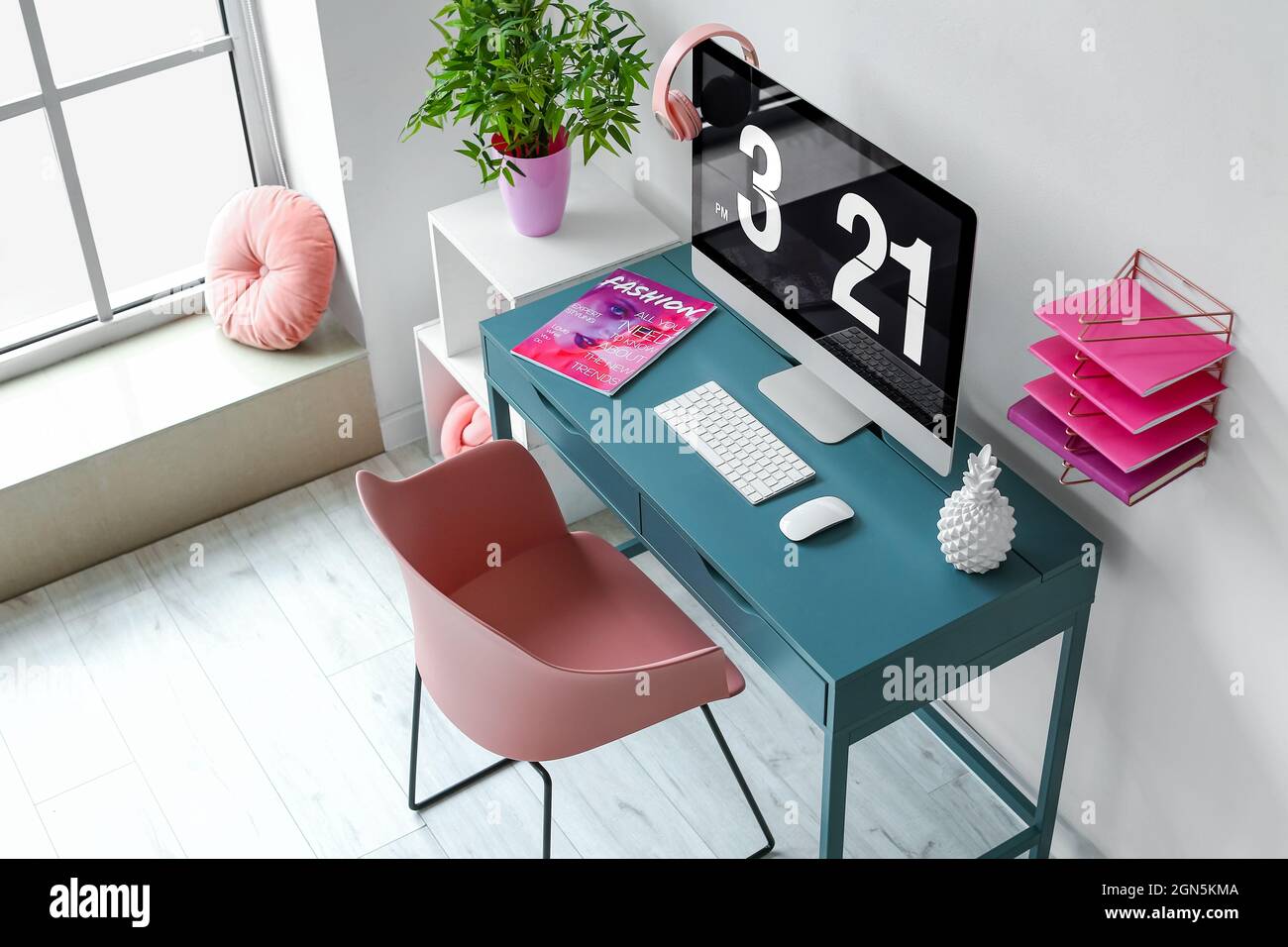 Workplace with modern computer and stylish decor near white wall in ...