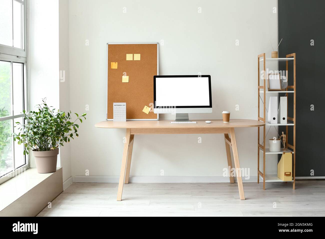 Interior of light room with modern workplace Stock Photo - Alamy