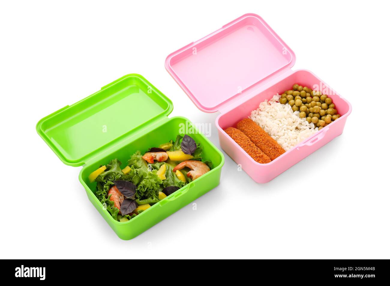 Containers with delicious fish fingers, rice, peas and salad on white ...
