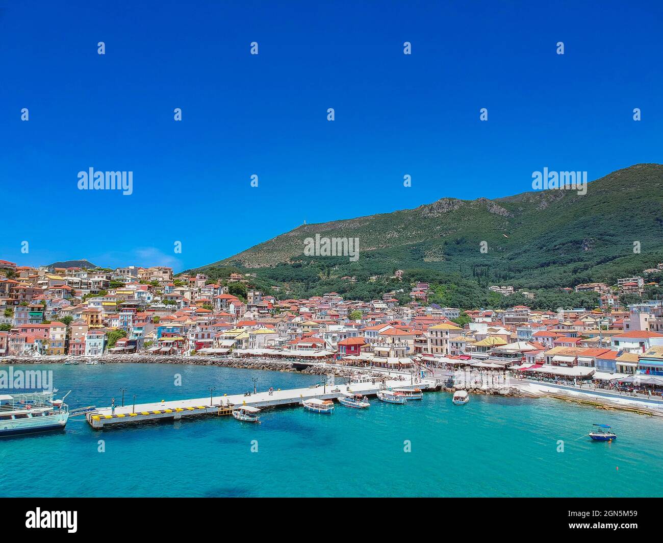 Aerial panoramic cityscape view over Parga coastal city, Epirus, Greece ...