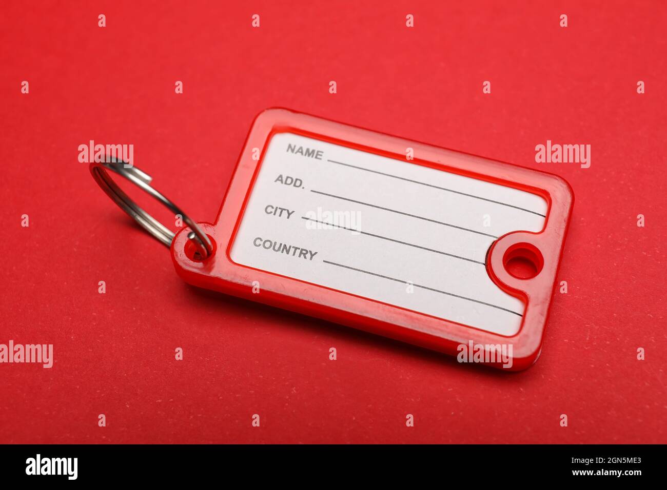Plastic key tag on color background, closeup Stock Photo - Alamy
