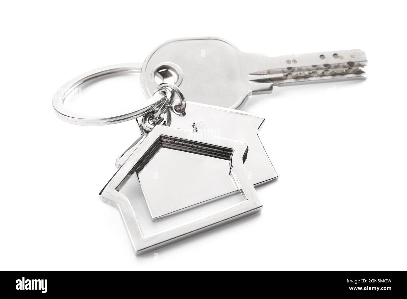 Key with house shape keychain on white background Stock Photo - Alamy