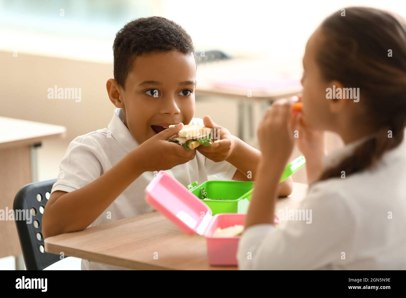 Cute little children having lunch at school Stock Photo - Alamy