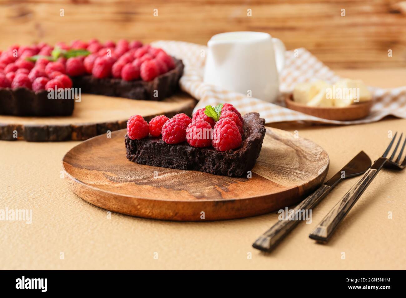 Plate with piece of tasty raspberry pie on color table, closeup Stock ...
