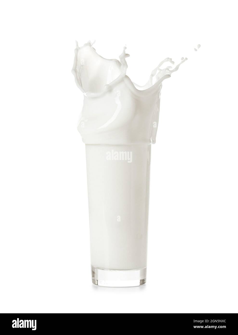 Glass of dynamic wave of milk splashing on white background Stock Photo ...