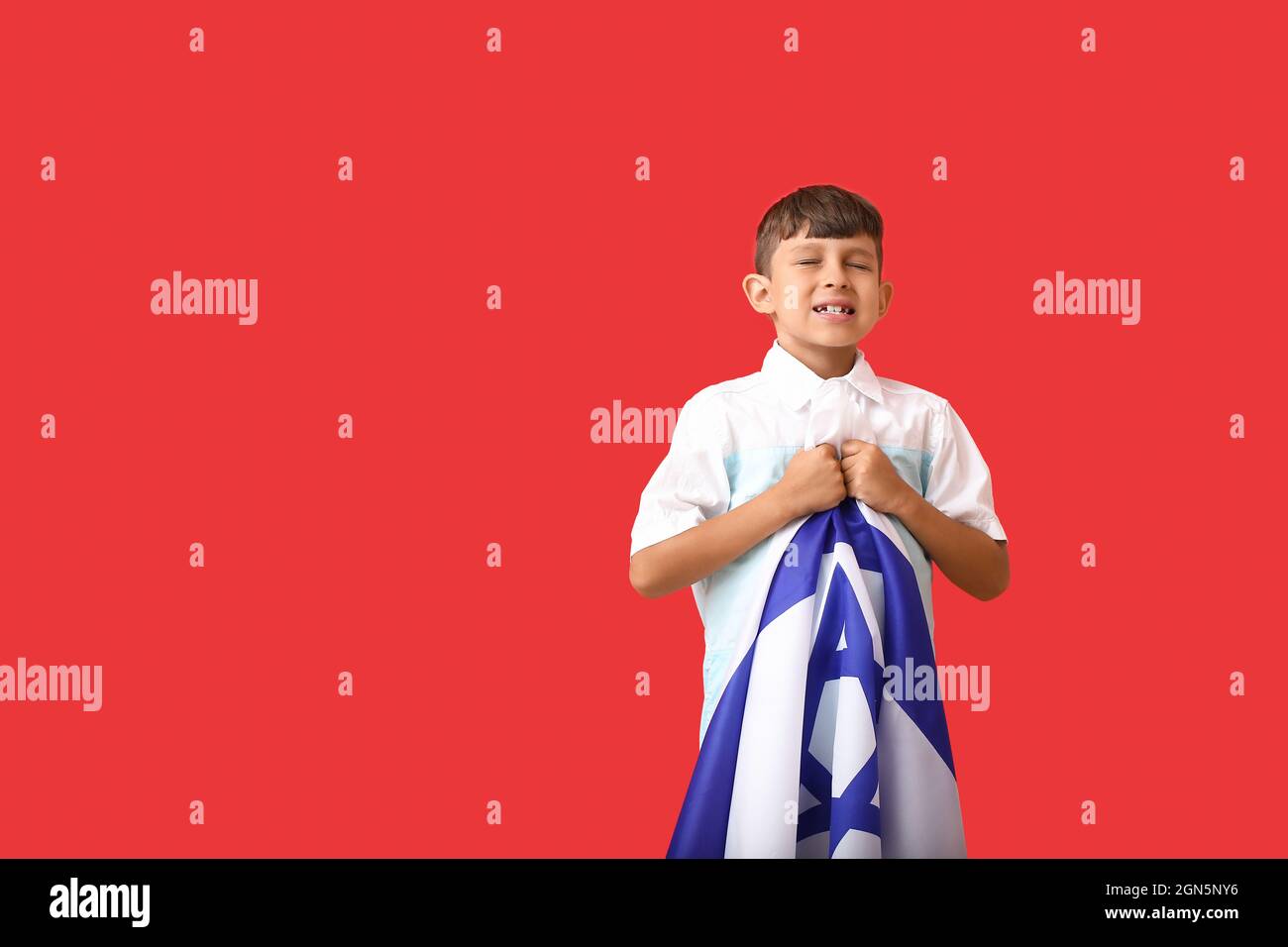 Little boy with the flag of Israel on color background Stock Photo - Alamy