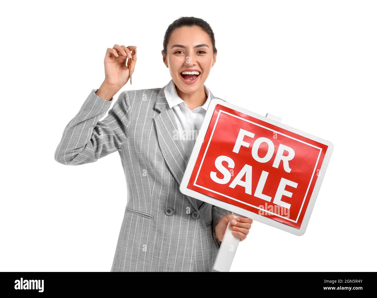 Real estate agent with FOR SALE sign on white background Stock Photo ...