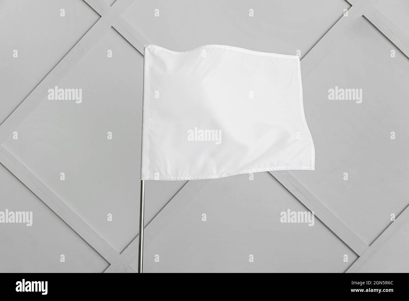 White flag on light background Stock Photo - Alamy