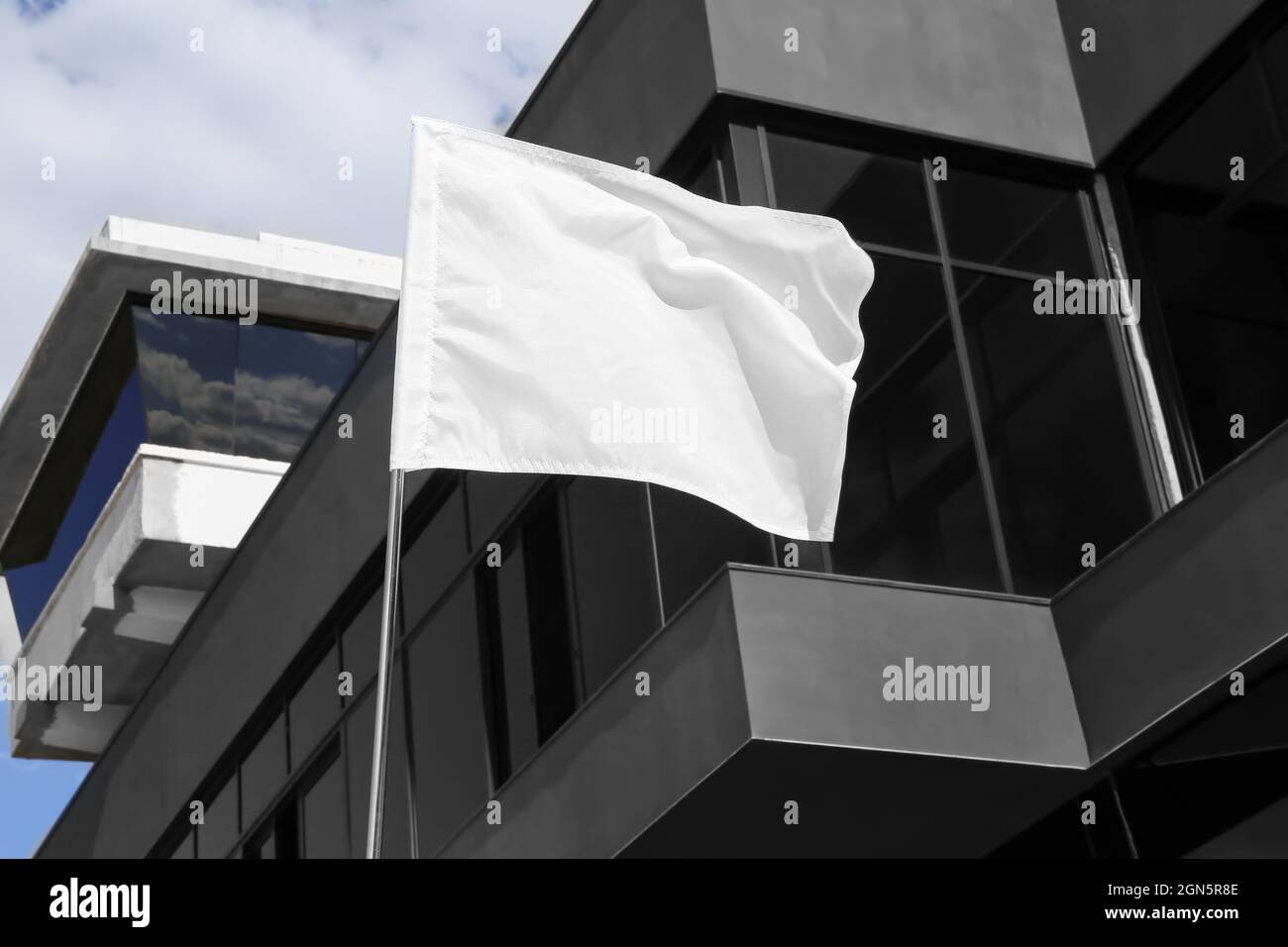 View of waving white flag outdoors Stock Photo - Alamy