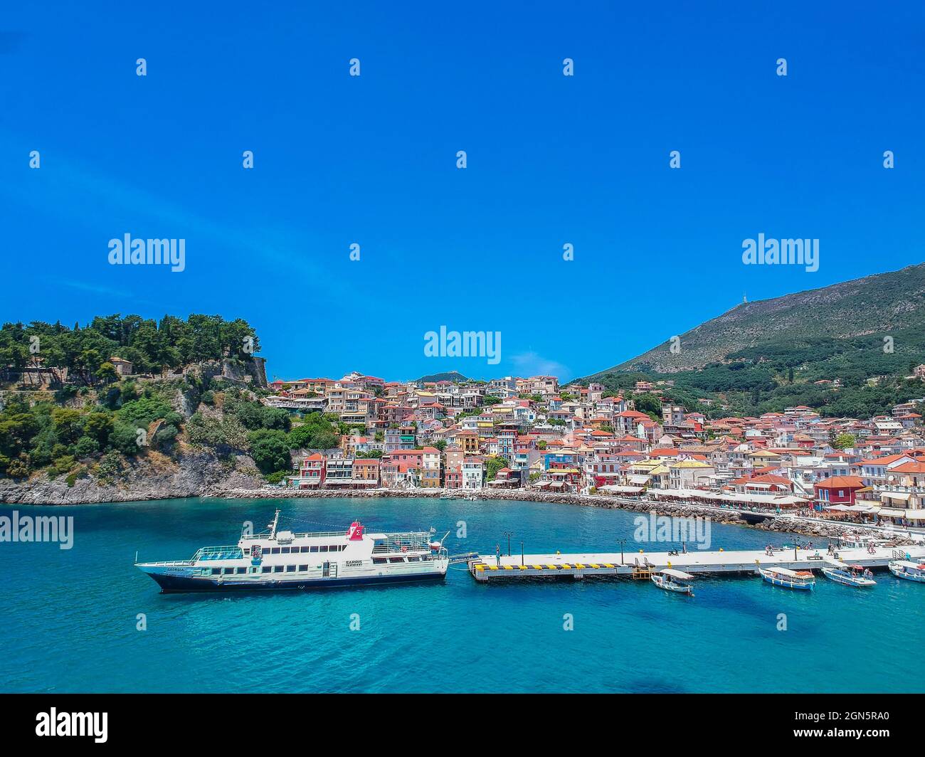 Aerial panoramic cityscape view over Parga coastal city, Epirus, Greece ...