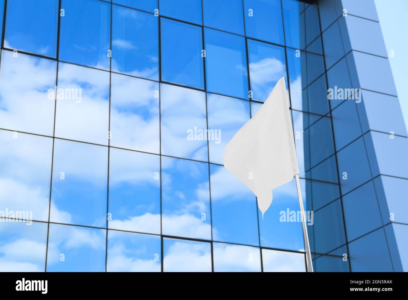 View of waving white flag outdoors Stock Photo - Alamy