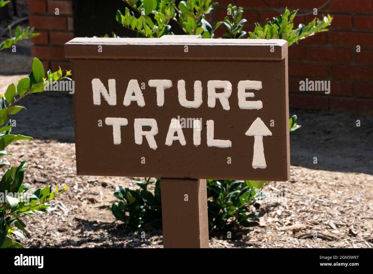 A wooden nature trail sign points way to trailhead Stock Photo - Alamy