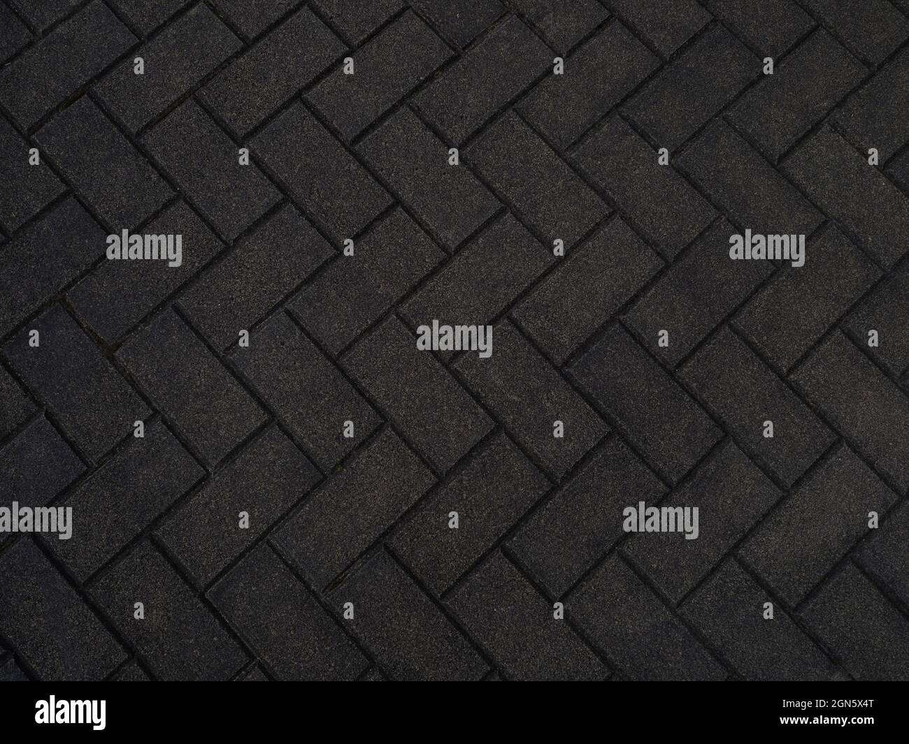 Dark gray paving block texture background Stock Photo - Alamy