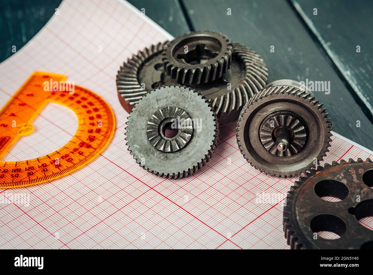 Car parts on graph paper close up. Engineering concept Stock Photo - Alamy
