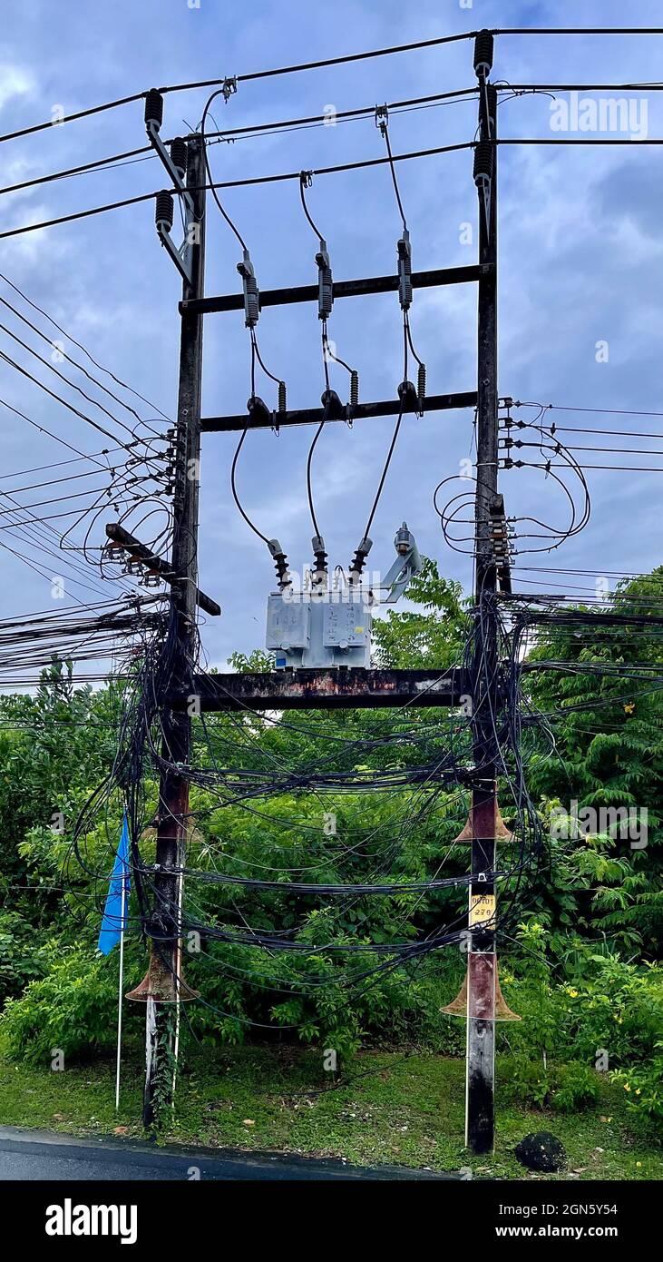 Vertical shot of a transmission tower by a road in Thailand Stock Photo ...