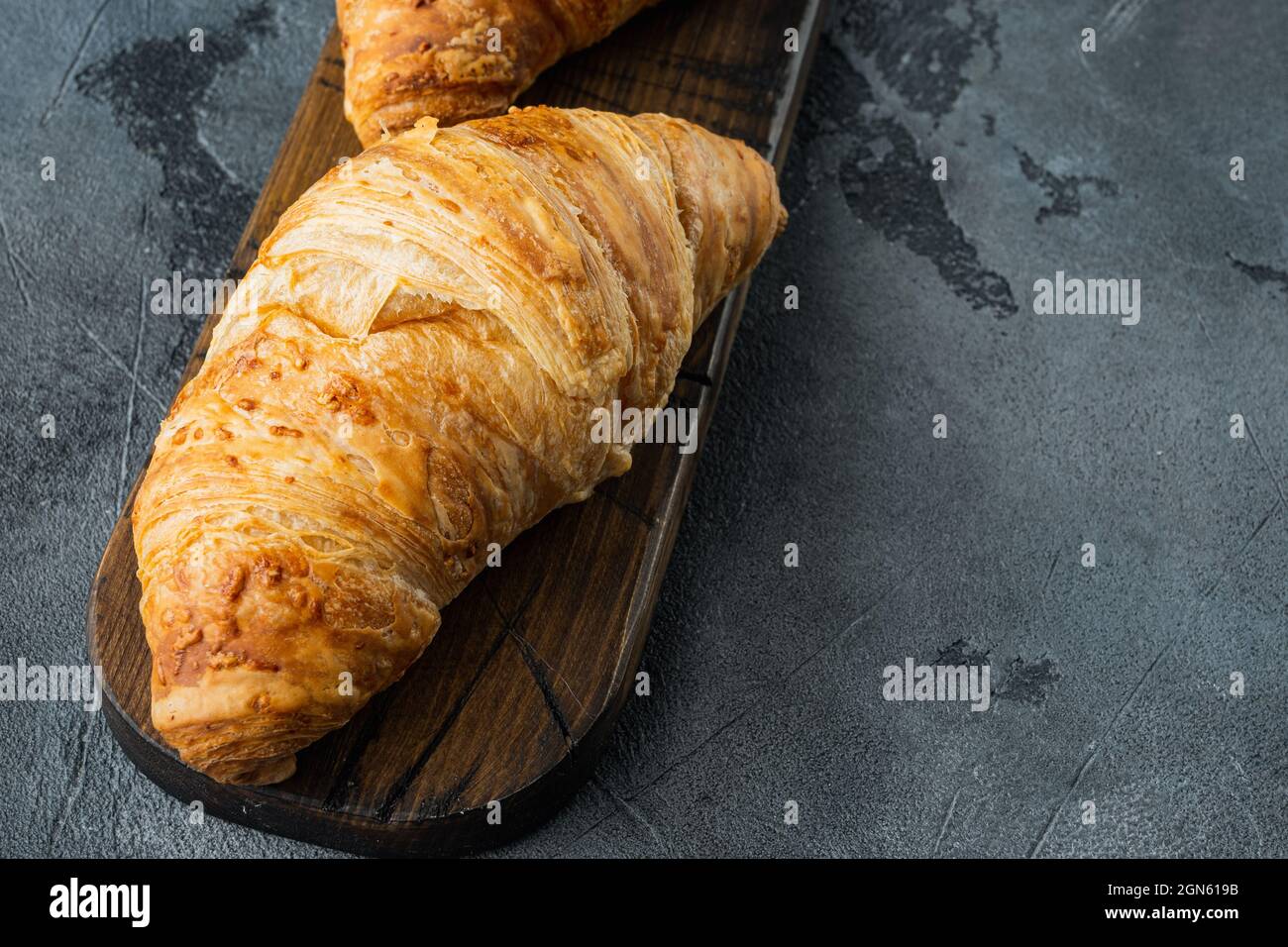 Crispy fresh croissants set, on gray stone background, with copy space ...
