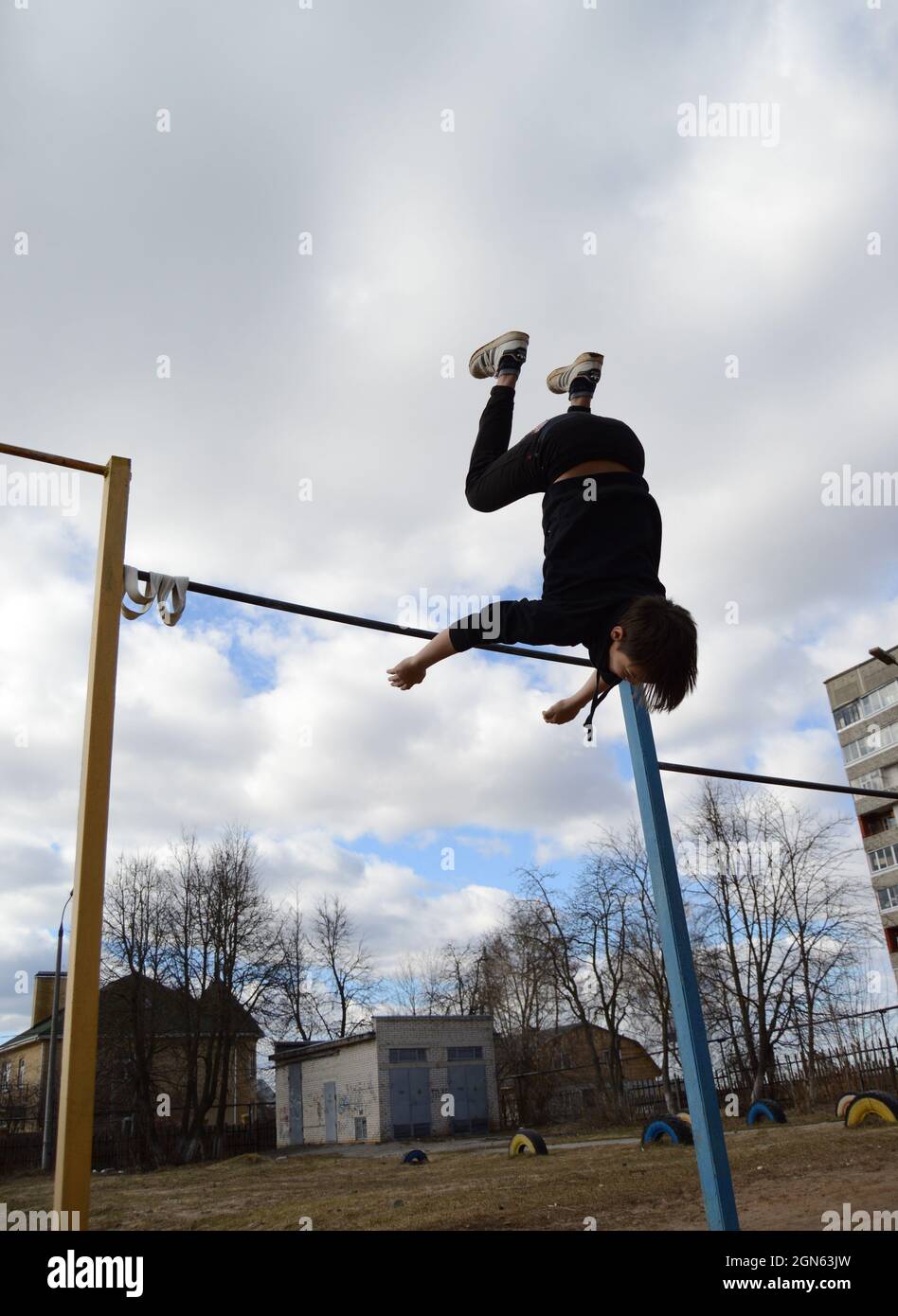 Kovrov, Russia. 26 March 2017. Teen is engaged in discipline gimbarr on a horizontal bar in the ...