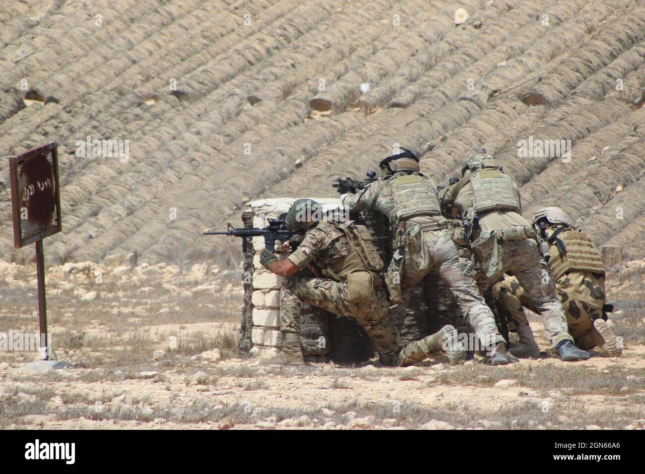 U.S. and partner Special Operations Forces secure a berm while ...